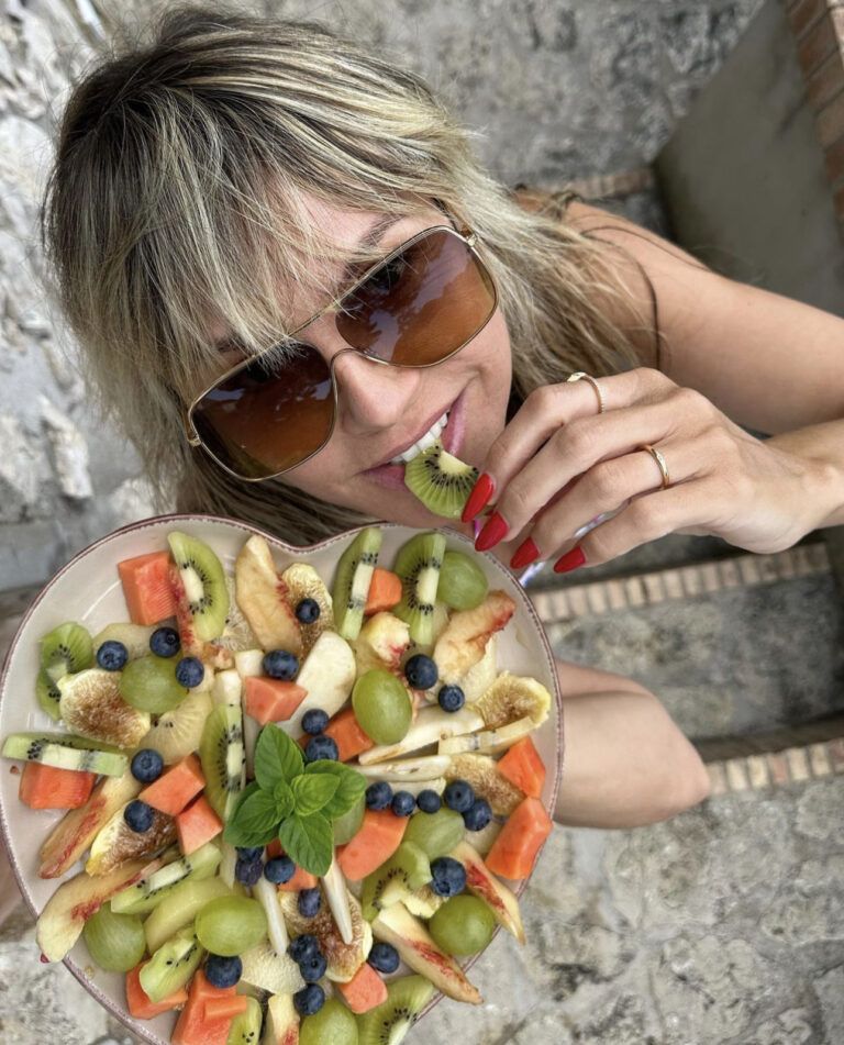 Wardrobe Breakdown: Heidi Klum In Cutout Floral-Print Halterneck ...